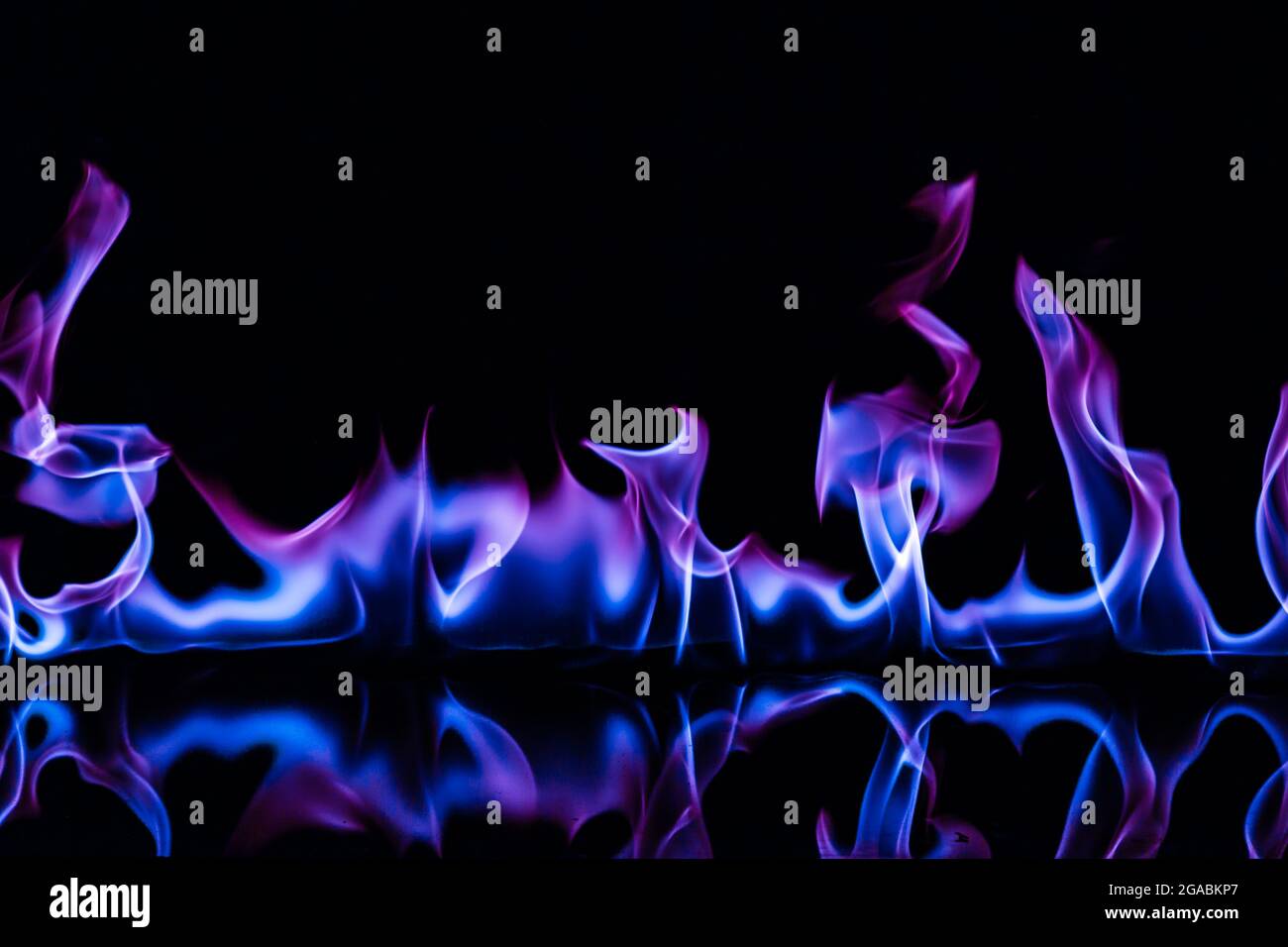 Blue color fire flames on black background Stock Photo - Alamy