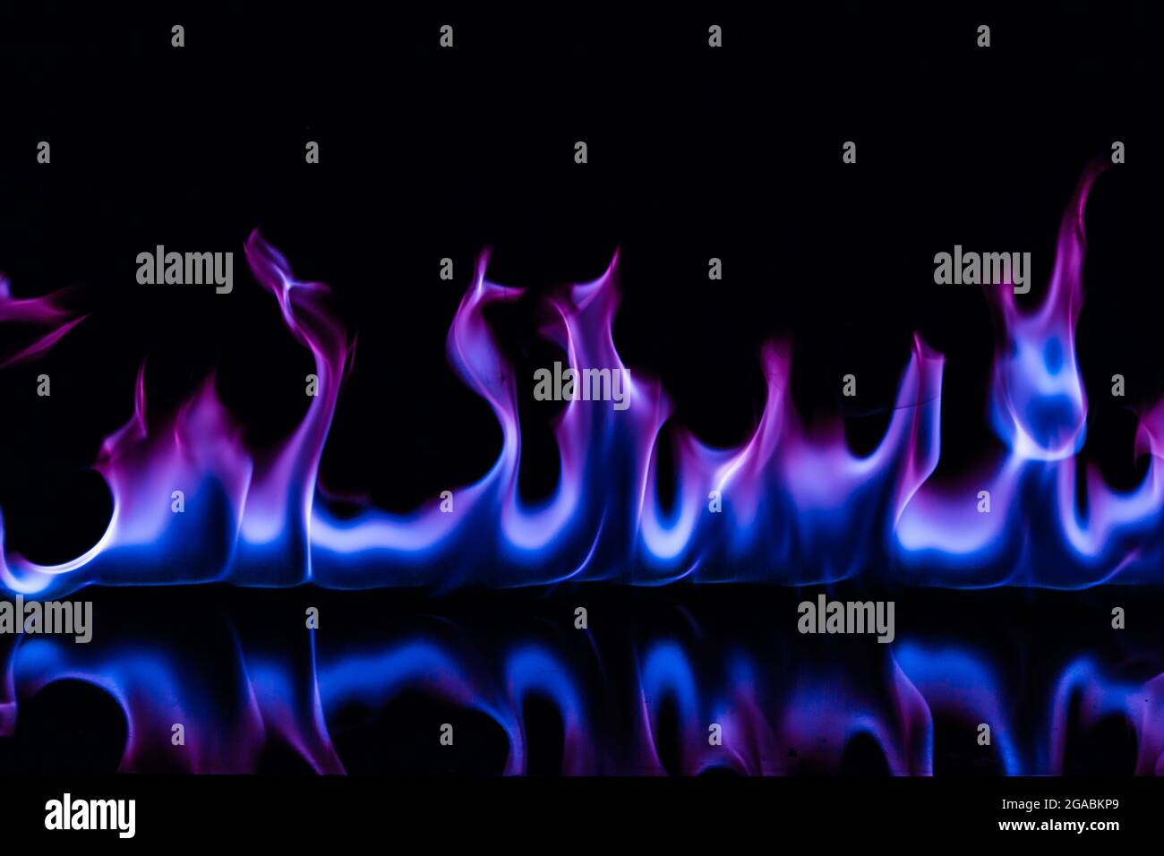 Blue color fire flames on black background Stock Photo - Alamy