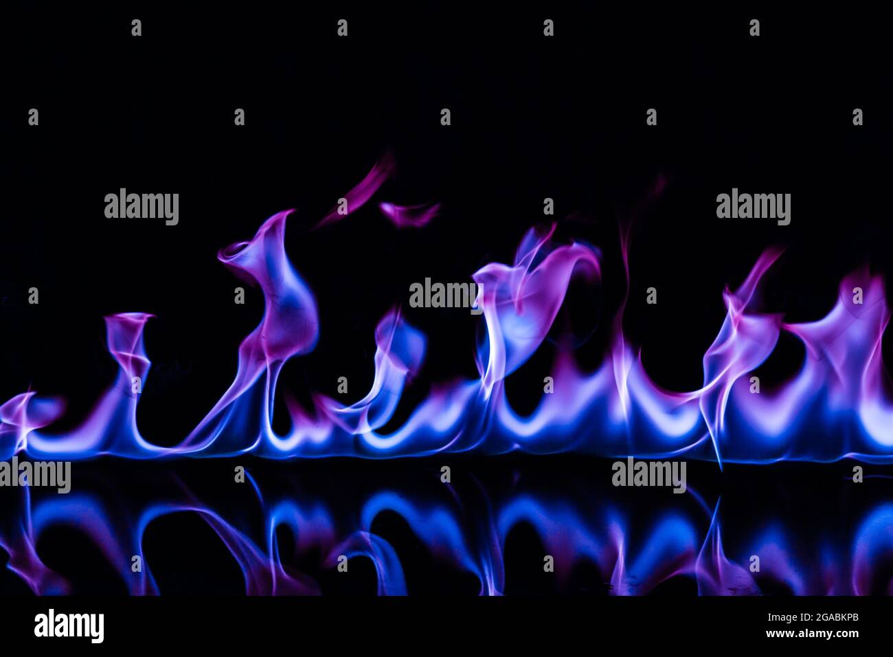 Blue color fire flames on black background Stock Photo - Alamy
