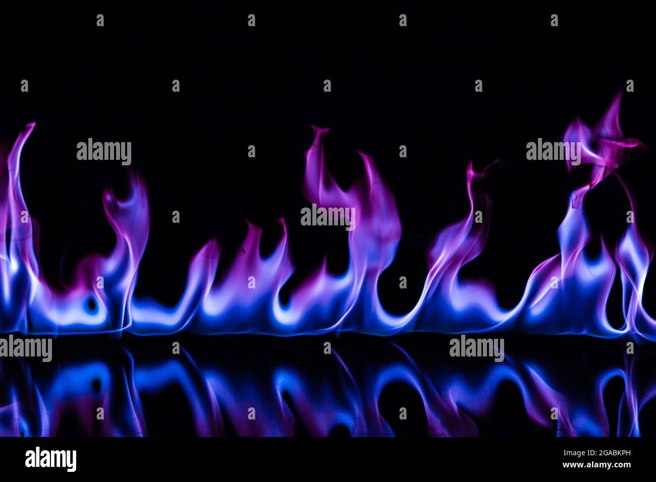 Blue color fire flames on black background Stock Photo - Alamy