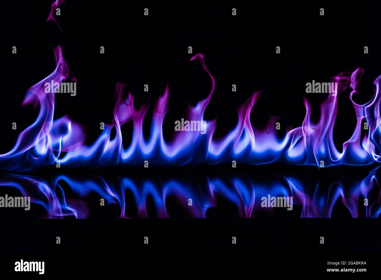 Blue color fire flames on black background Stock Photo - Alamy