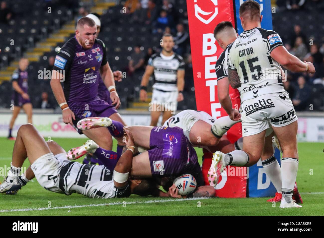 The Hull FC defence stop Mikolaj Oledzki (8) of Leeds Rhinos short of ...