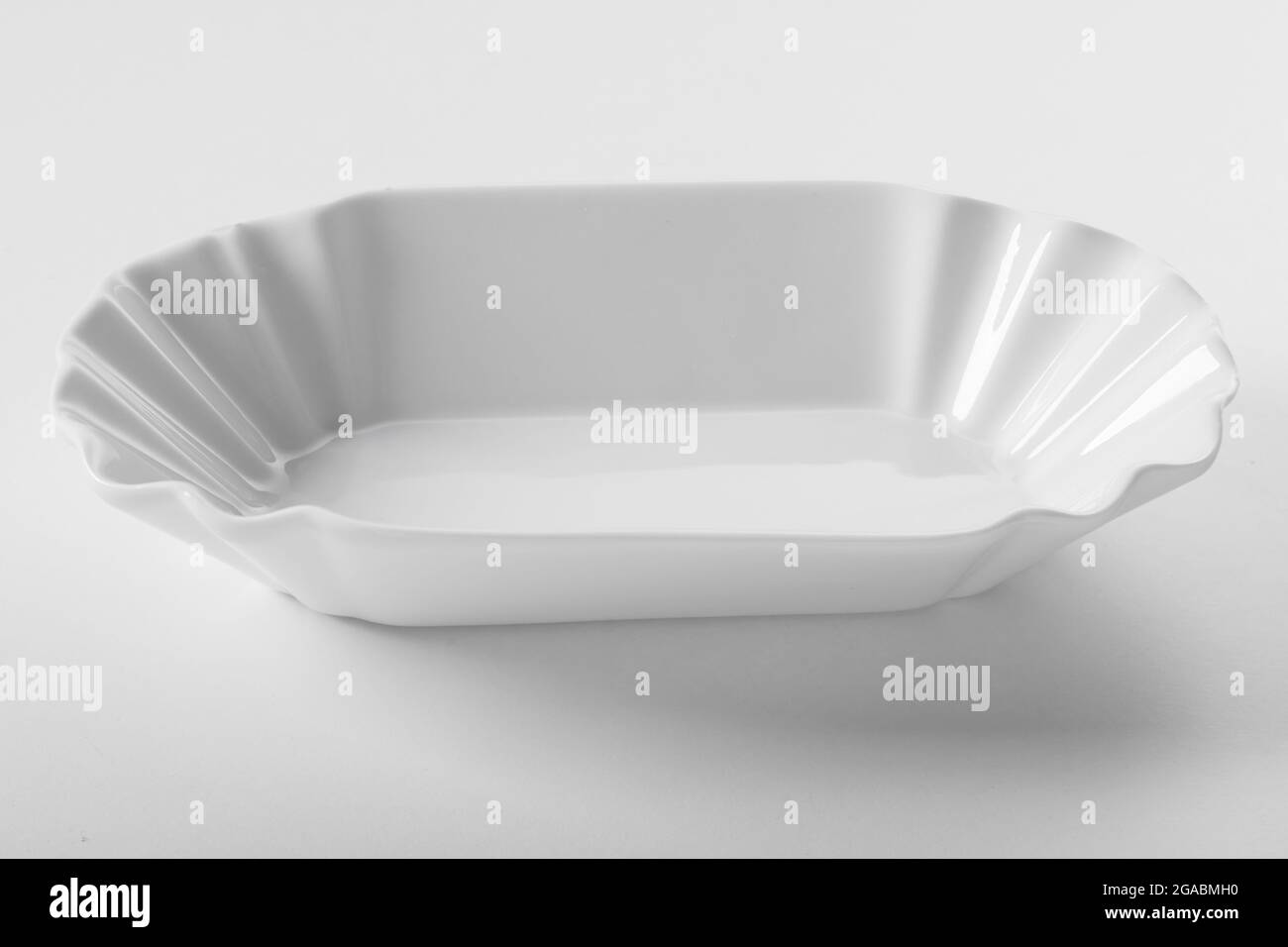 High angle of home basic oval white ceramic serving plate with wavy ...