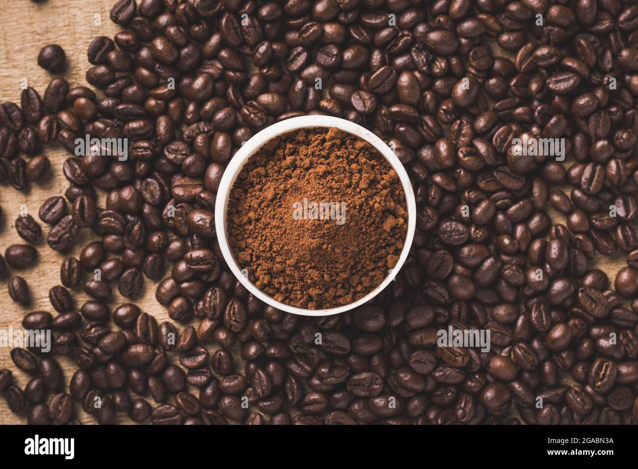 Coffee beans and powder with textured background stock image Stock ...