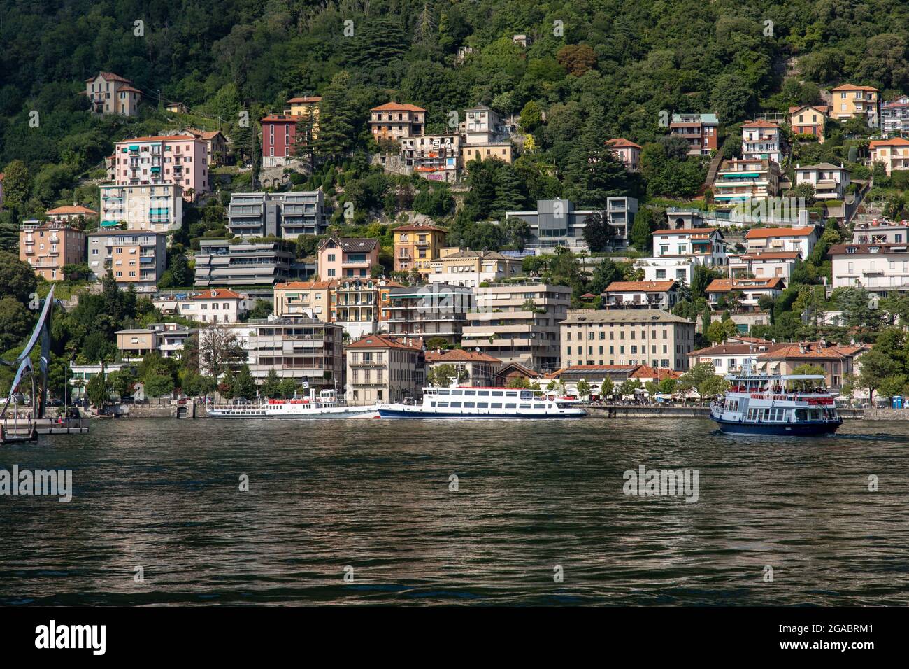 ferry boats on lake in Como port Italy Stock Photo - Alamy