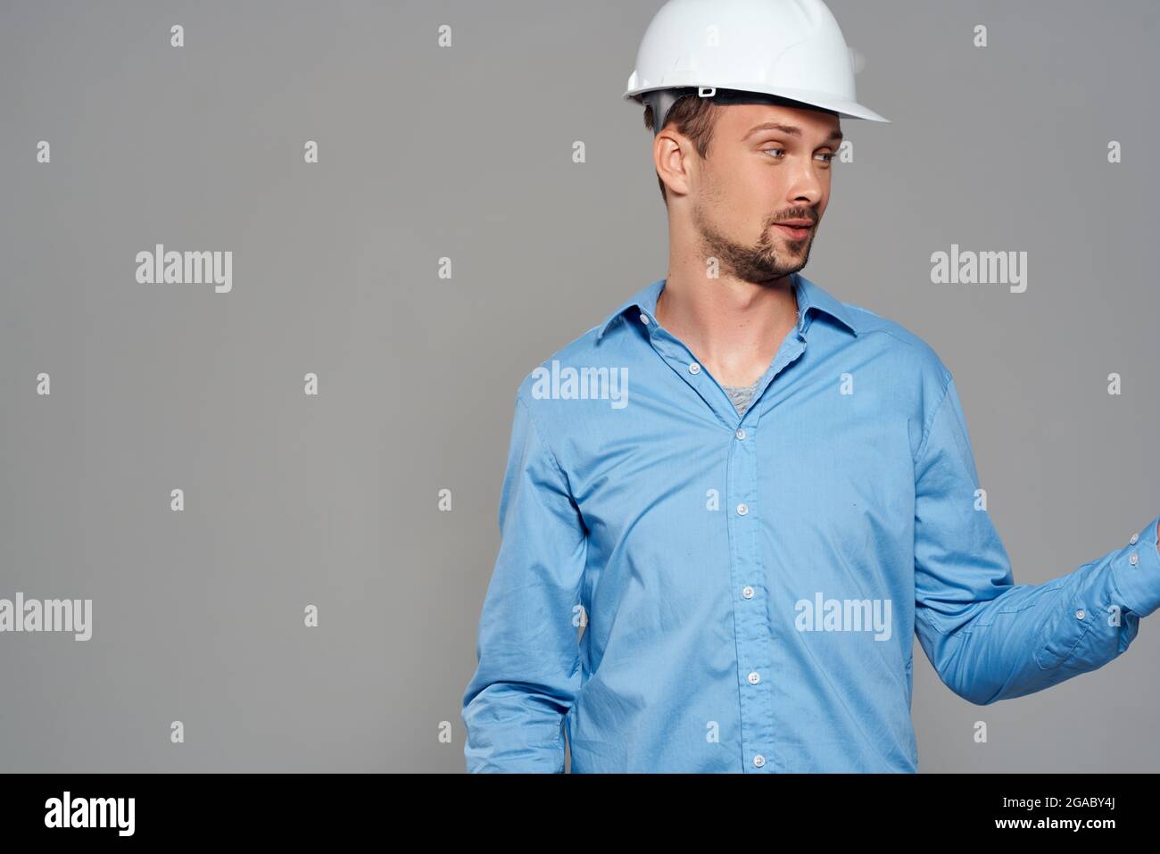 man in blue shirt engineer construction helmet safety work Stock Photo ...