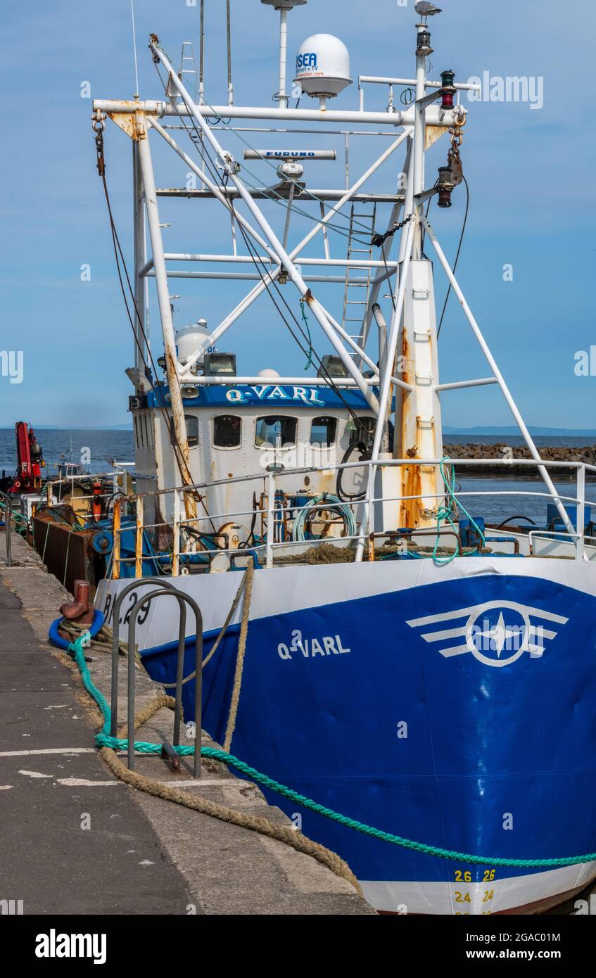 Fishing trawlers and boats alongside the wall berthed in Girvan harbour ...