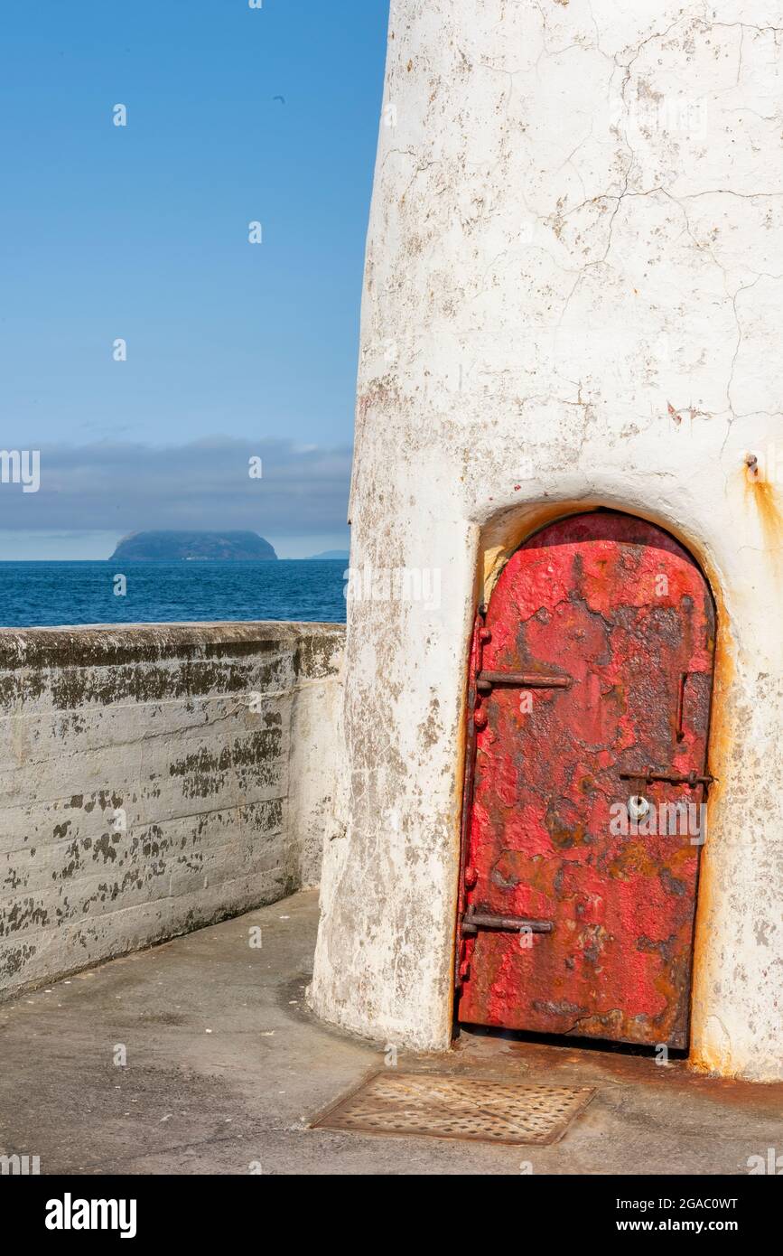old battered weather beaten door on the lighthouse on the entrance to ...