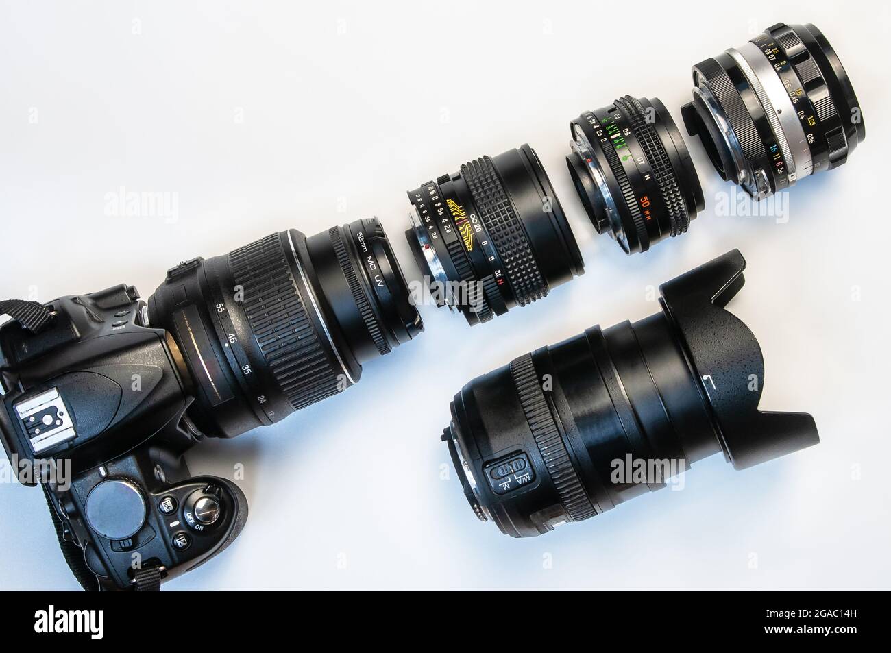 camera and photo lenses on white background. Concept of interchangeable ...