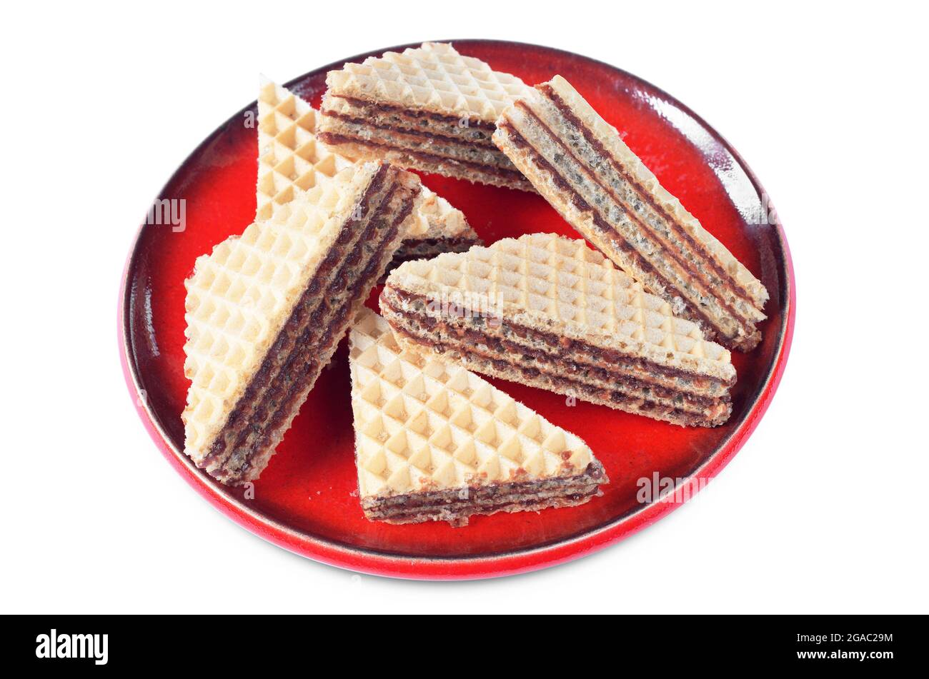 Wafers with chocolate in red plate on white background Stock Photo - Alamy