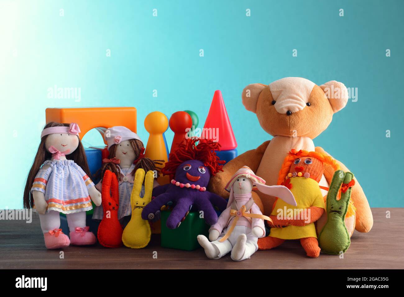 Pile of toys on blue background Stock Photo - Alamy