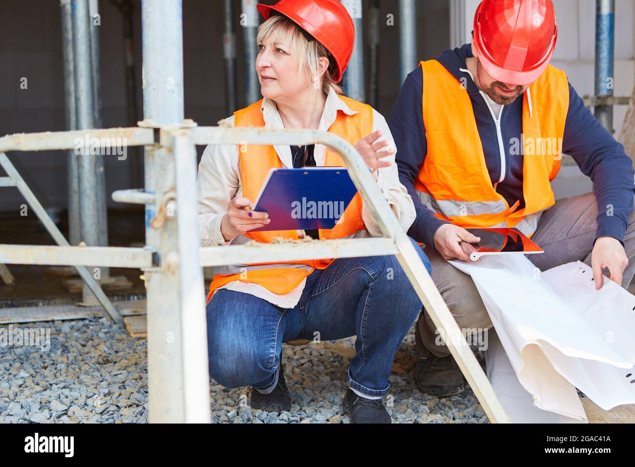 Architects team inspecting a construction site with checklist on ...