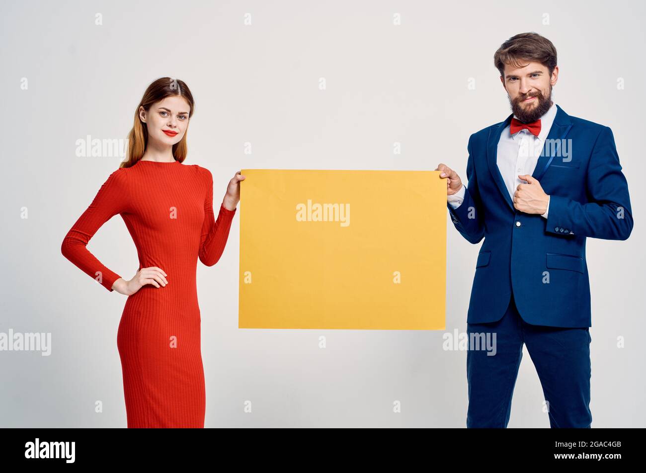 man and woman behind yellow mocap poster advertising presentation Stock ...
