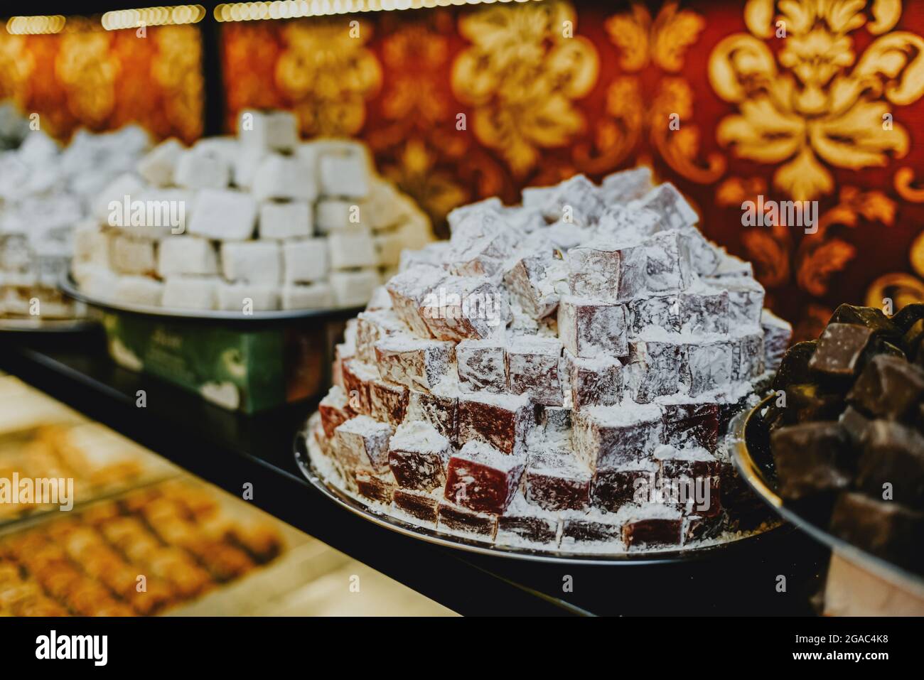 Turkish sweets on plates in the shop window Stock Photo - Alamy