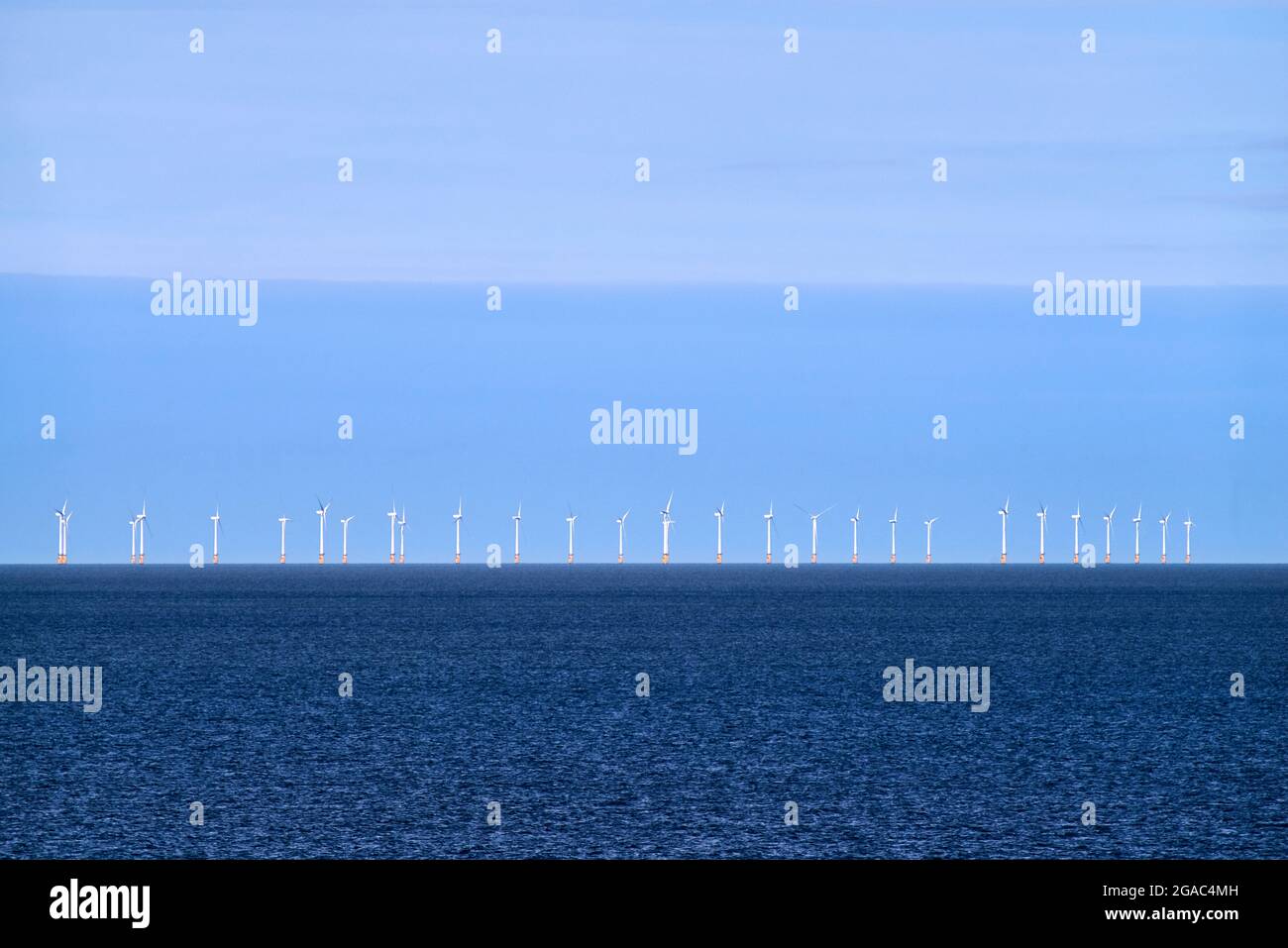 Offshore wind turbines on the horizon Stock Photo - Alamy