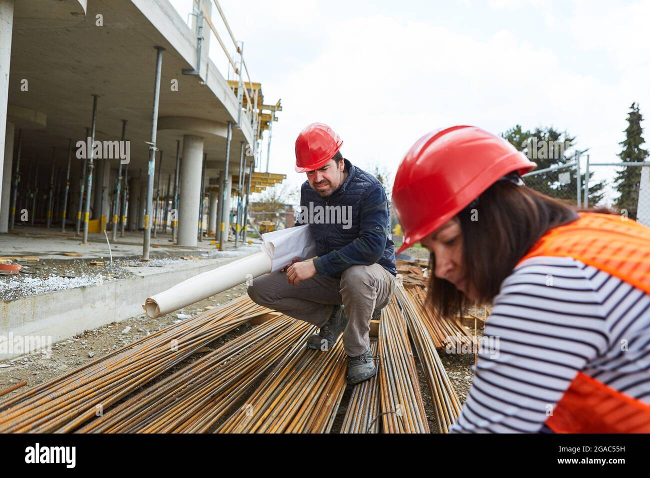 Architect and craftsman woman check structural steel delivery on the ...