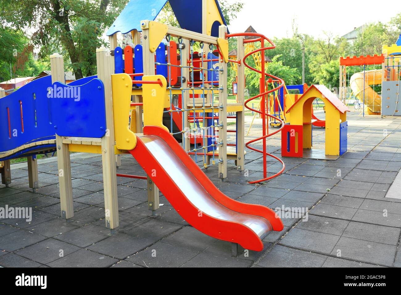 Colorful children playground in park Stock Photo - Alamy