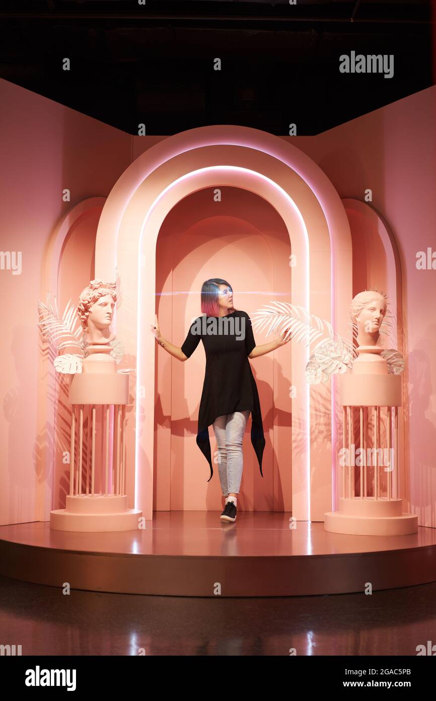 Beautiful women in cyber futuristic style is teleporting to destination ...