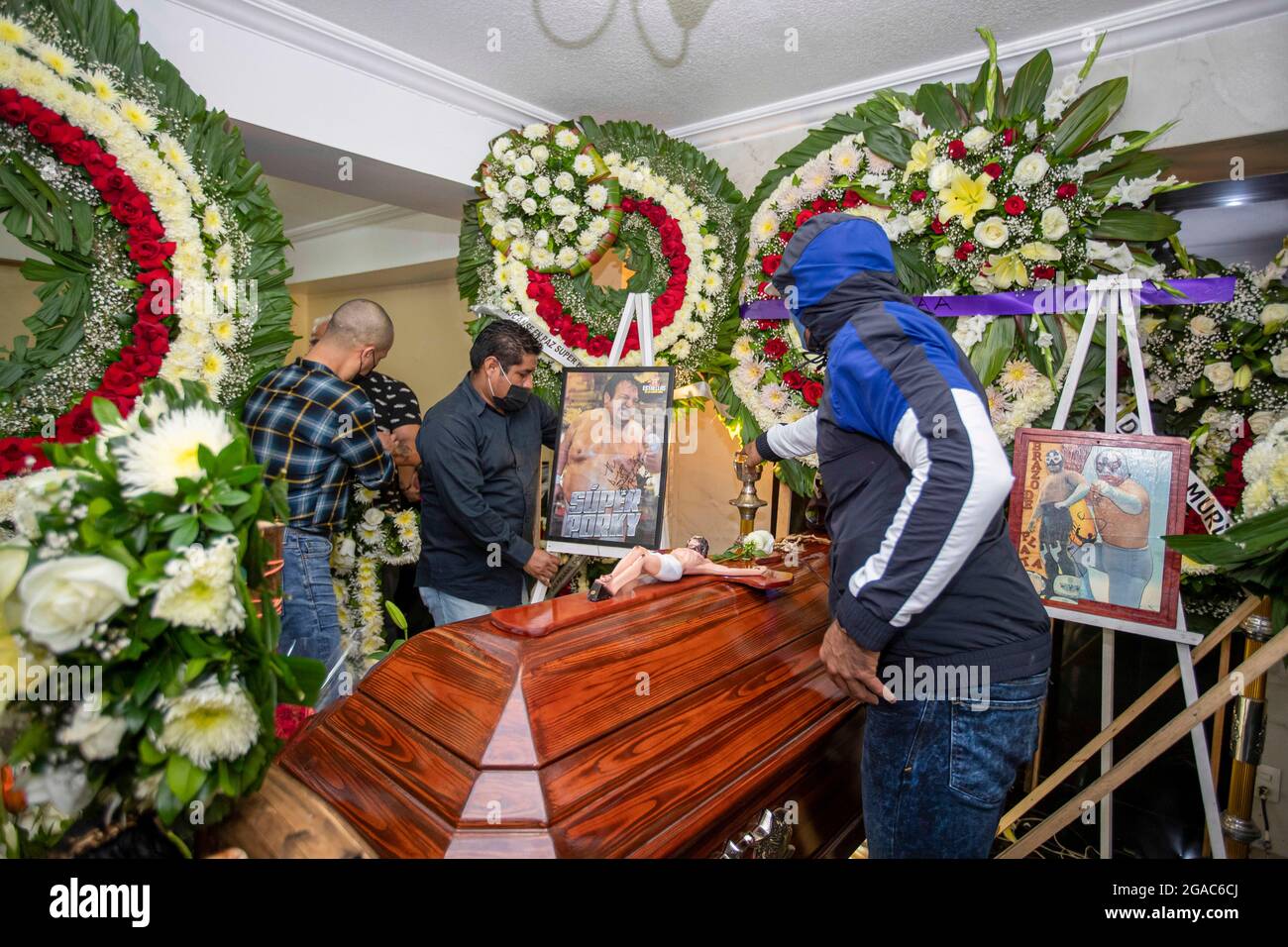 MEXICO CITY, MEXICO - JULY 27: Family and friends attend the funeral of ...