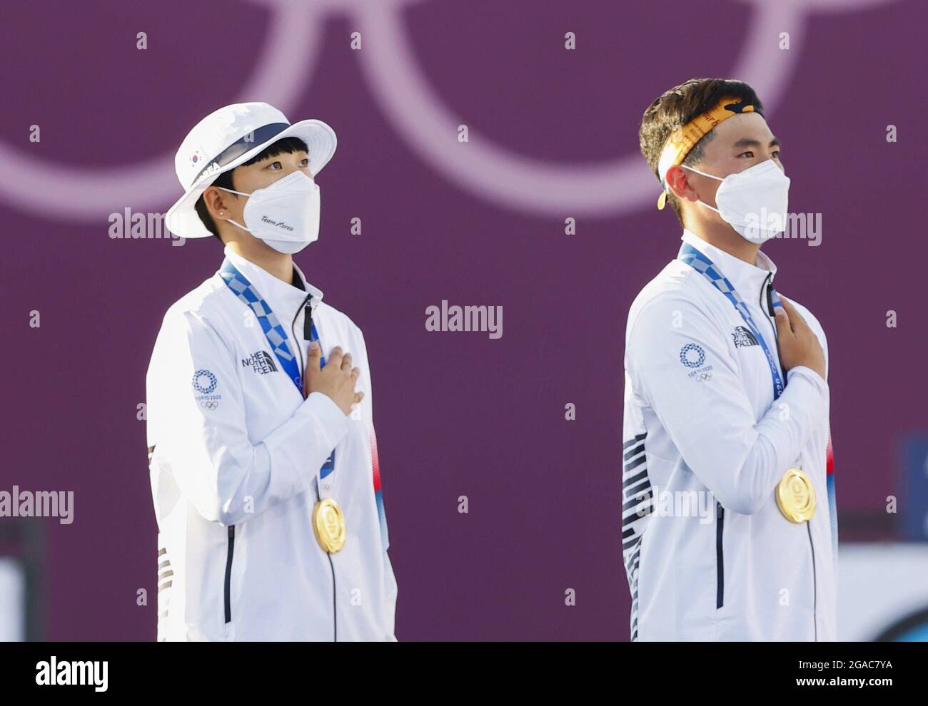 An San (L) and Kim Je Deok of South Korea attend a medal ceremony after ...