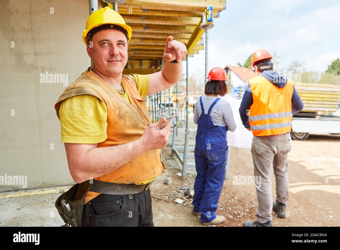 Construction worker with tablet computer on the construction site of ...