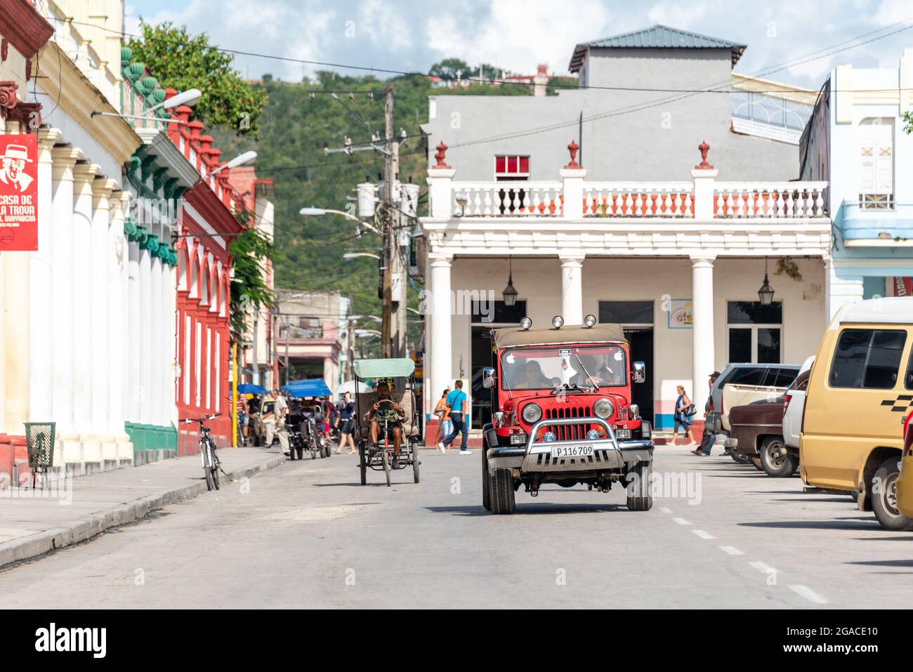Jeep driving in city street,Holguin, Cuba, 2016 Stock Photo - Alamy
