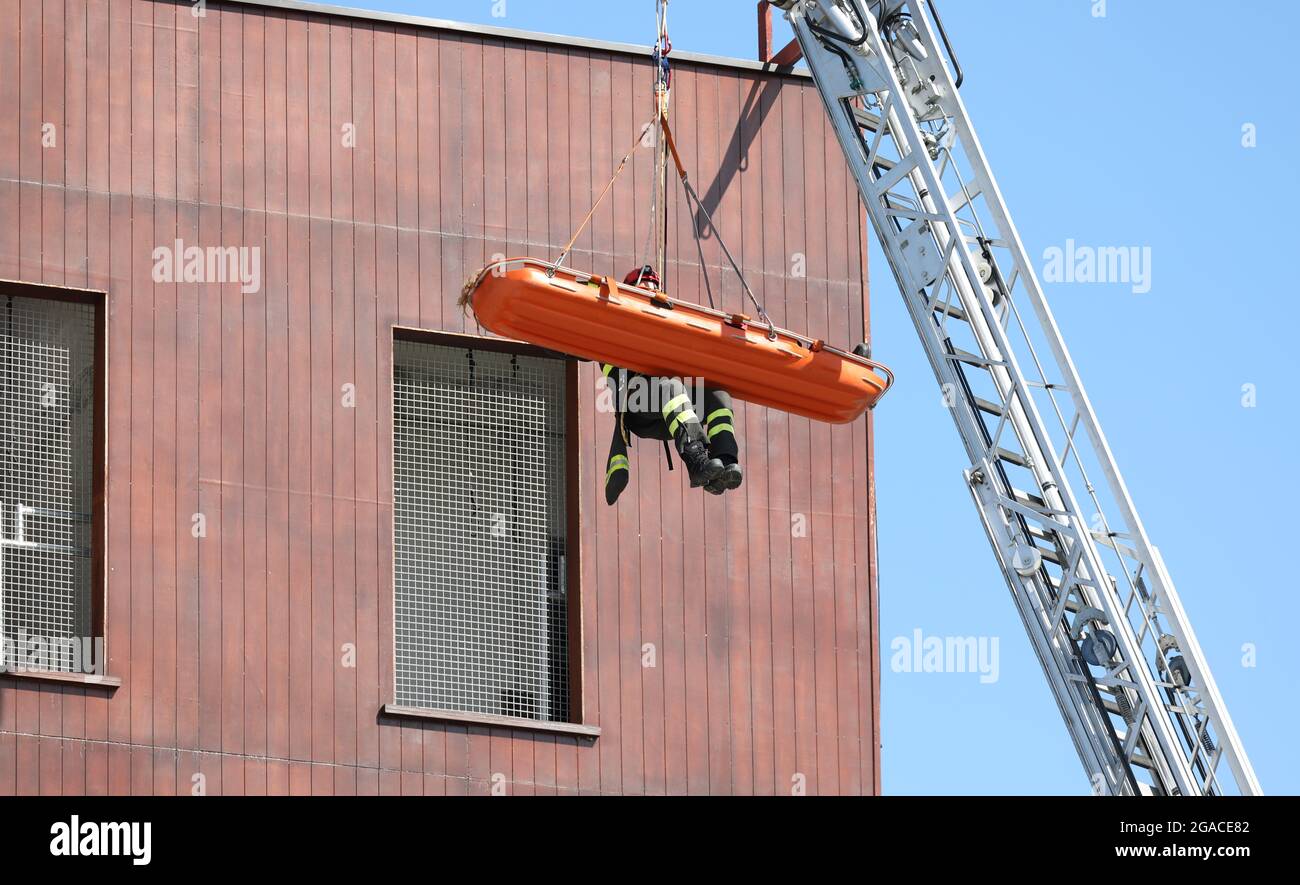 Brave Fire Brigade Recovers Wounded With A Stretcher Suspended In The ...