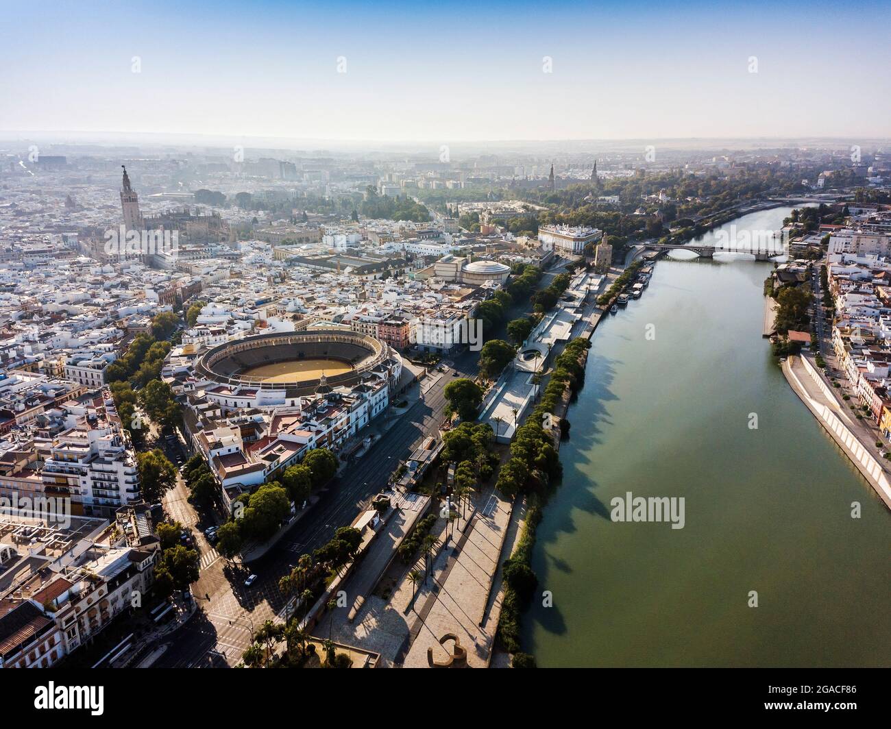 Aerial view of Seville with visible bullring and cathedral tower ...
