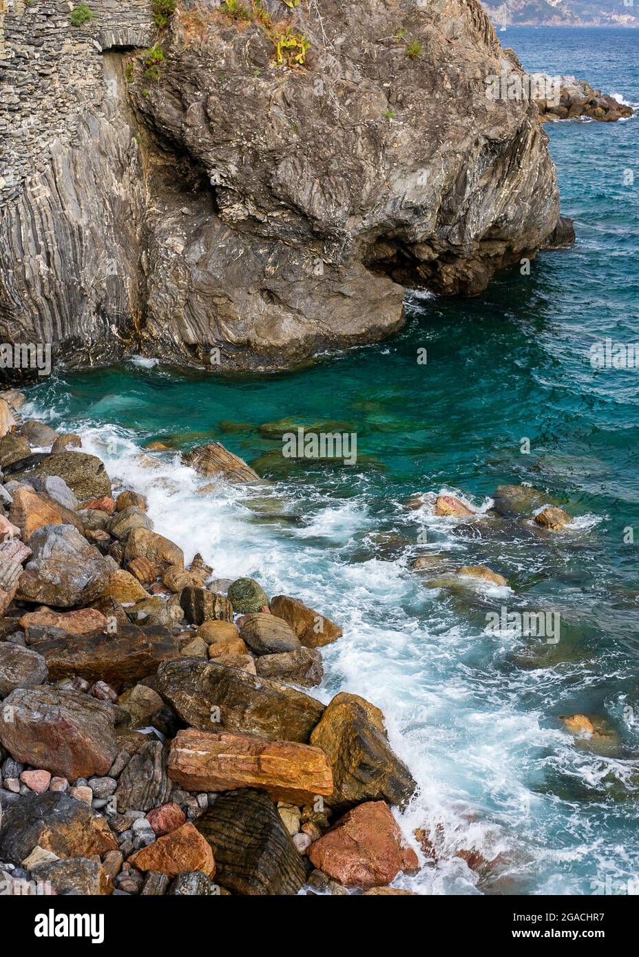 Sunset view of seaside rock formations crashed by crazy sea waves Stock ...
