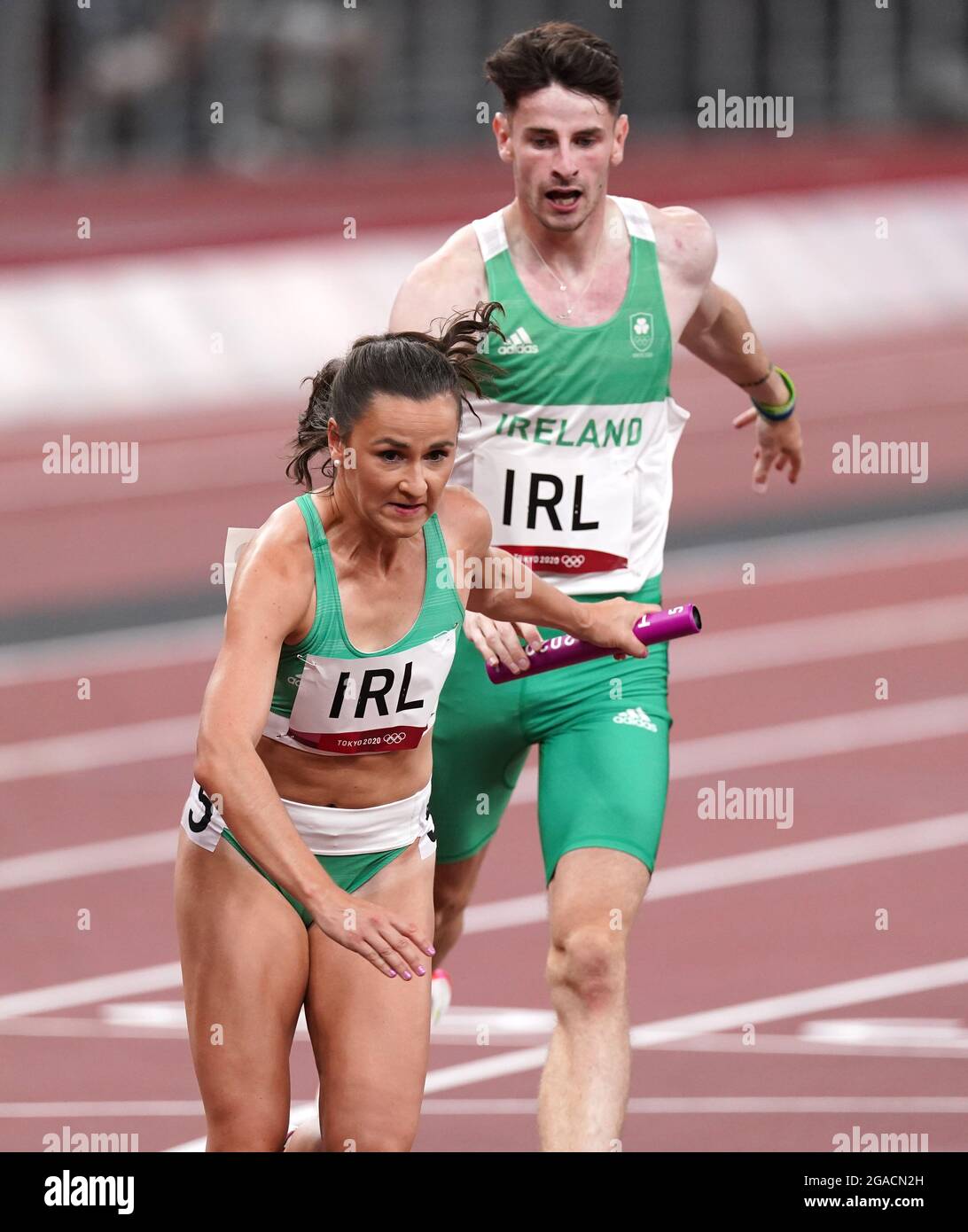 Ireland's Cillin Greene (back) hands the baton to Phil Healy during the ...