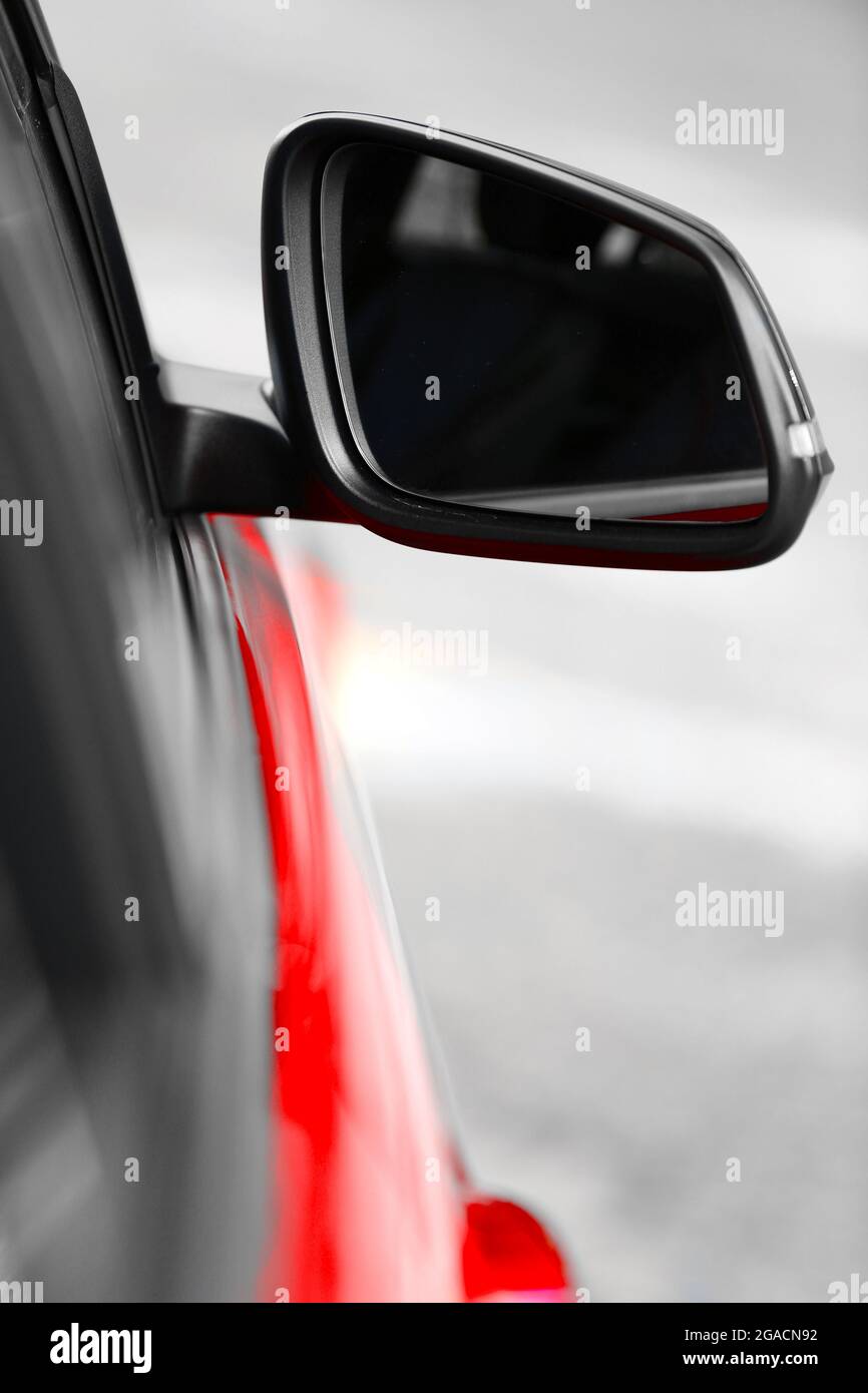 Rear view mirror of red car Stock Photo - Alamy