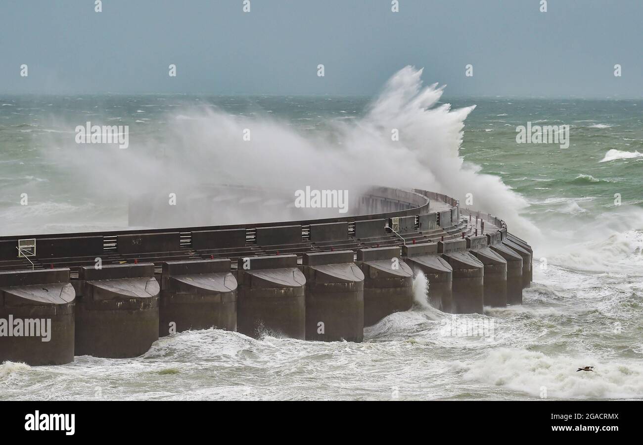 Brighton UK 30th July 2021 - Waves crash over Brighton Marina west wall ...