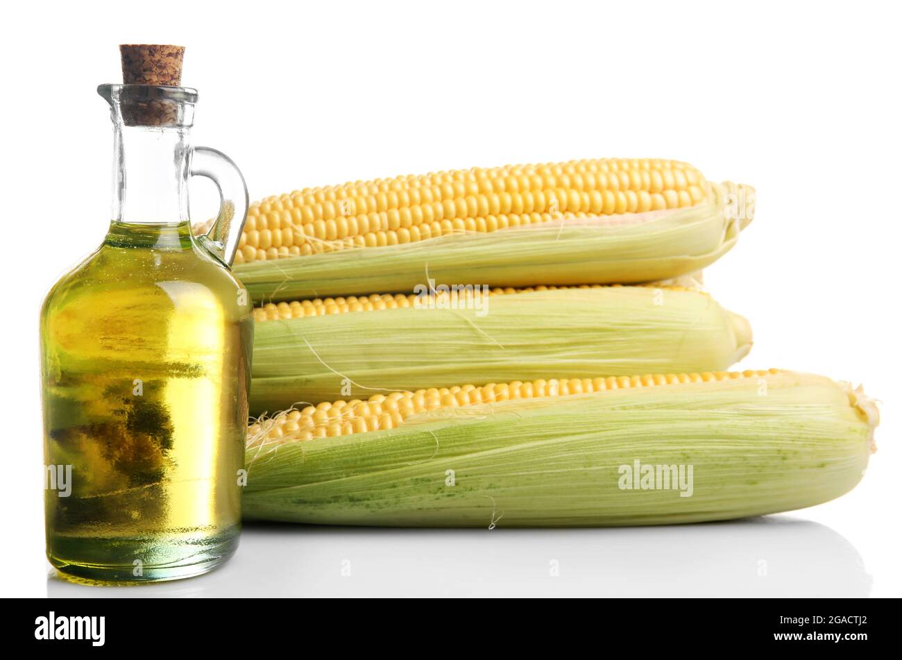 Fresh corn with bottle of oil isolated on white Stock Photo - Alamy