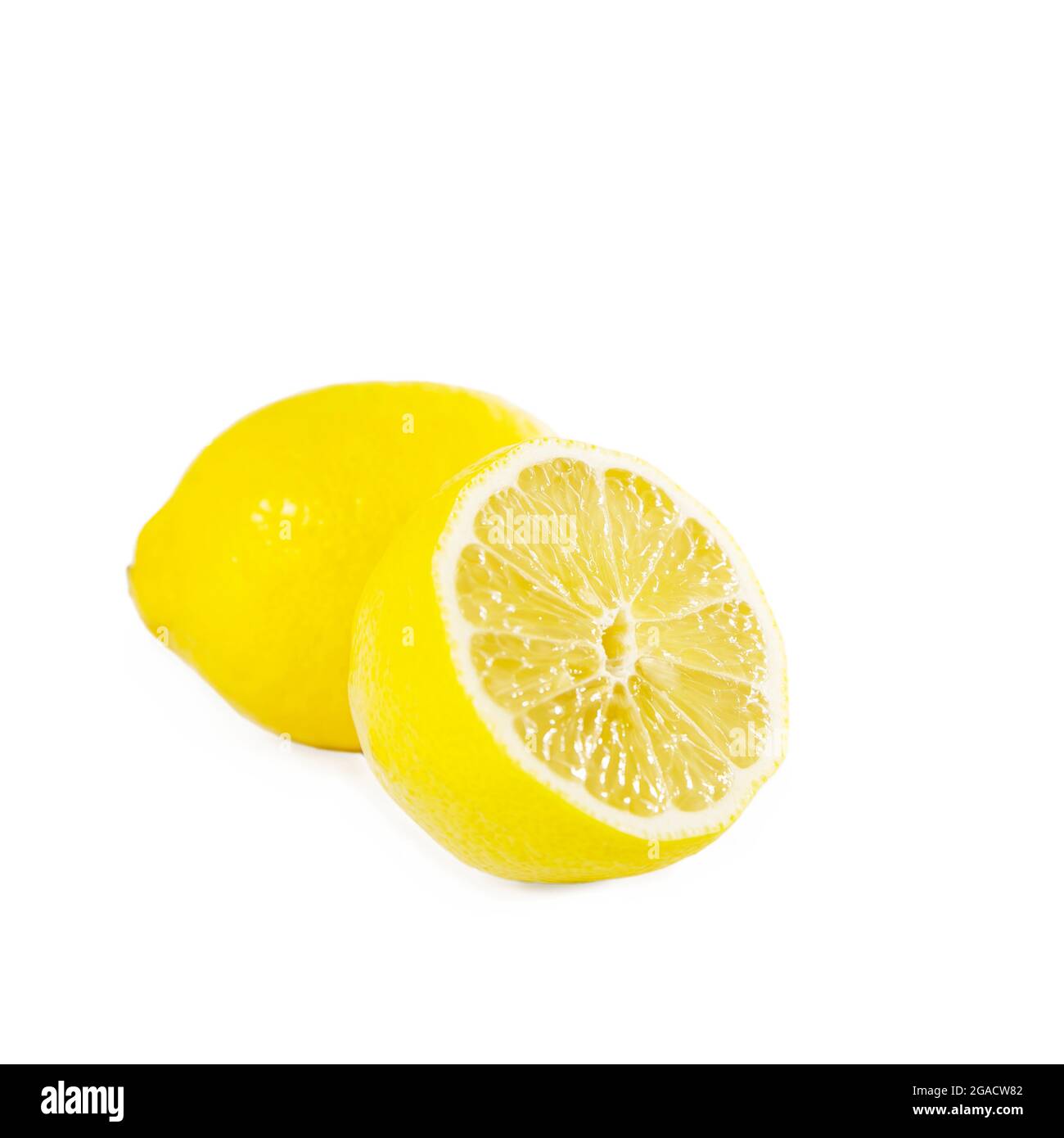 Half sliced lemon is on white background Stock Photo - Alamy