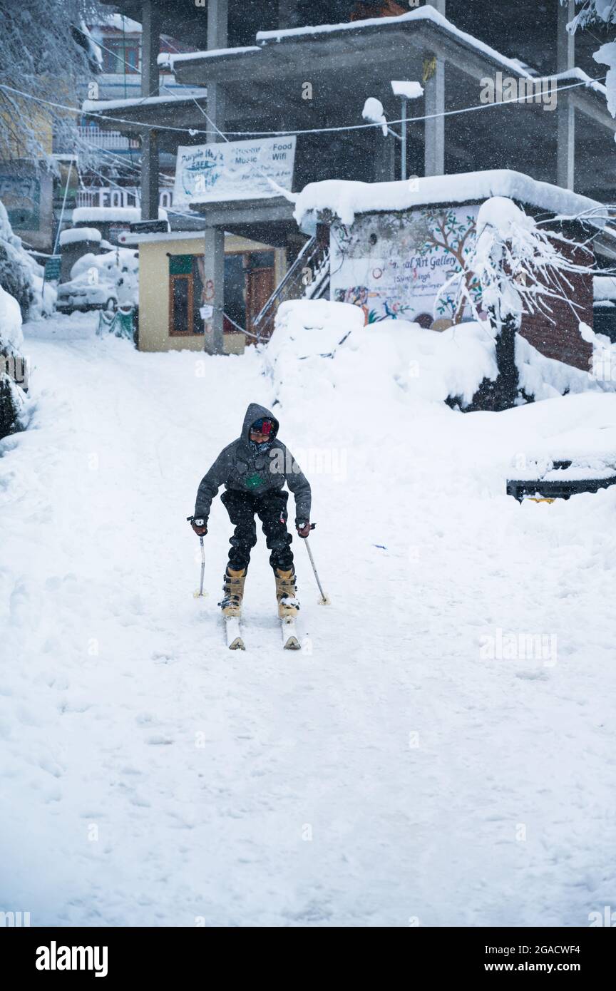 MANALI, INDIA - Jan 20, 2020: A vertical shot of an Indian child skiing ...