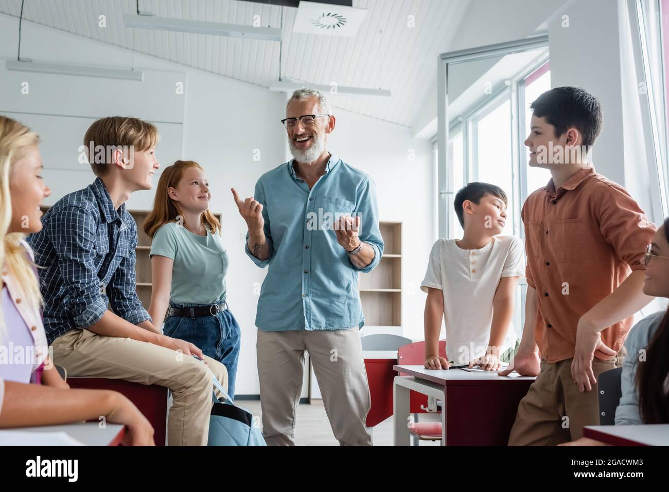Teacher pointing finger near hi-res stock photography and images - Alamy
