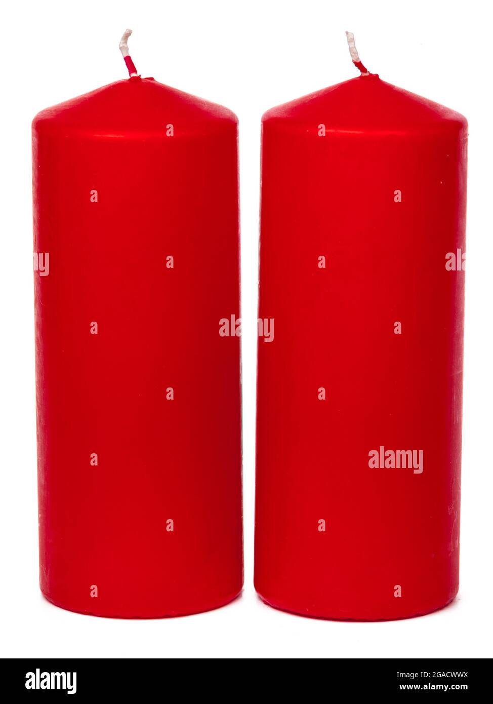 A selection of red candles on a white background Stock Photo - Alamy