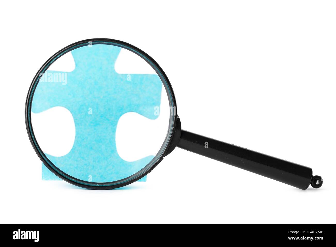 magnifying glass searching for missing puzzle pieces Stock Photo - Alamy