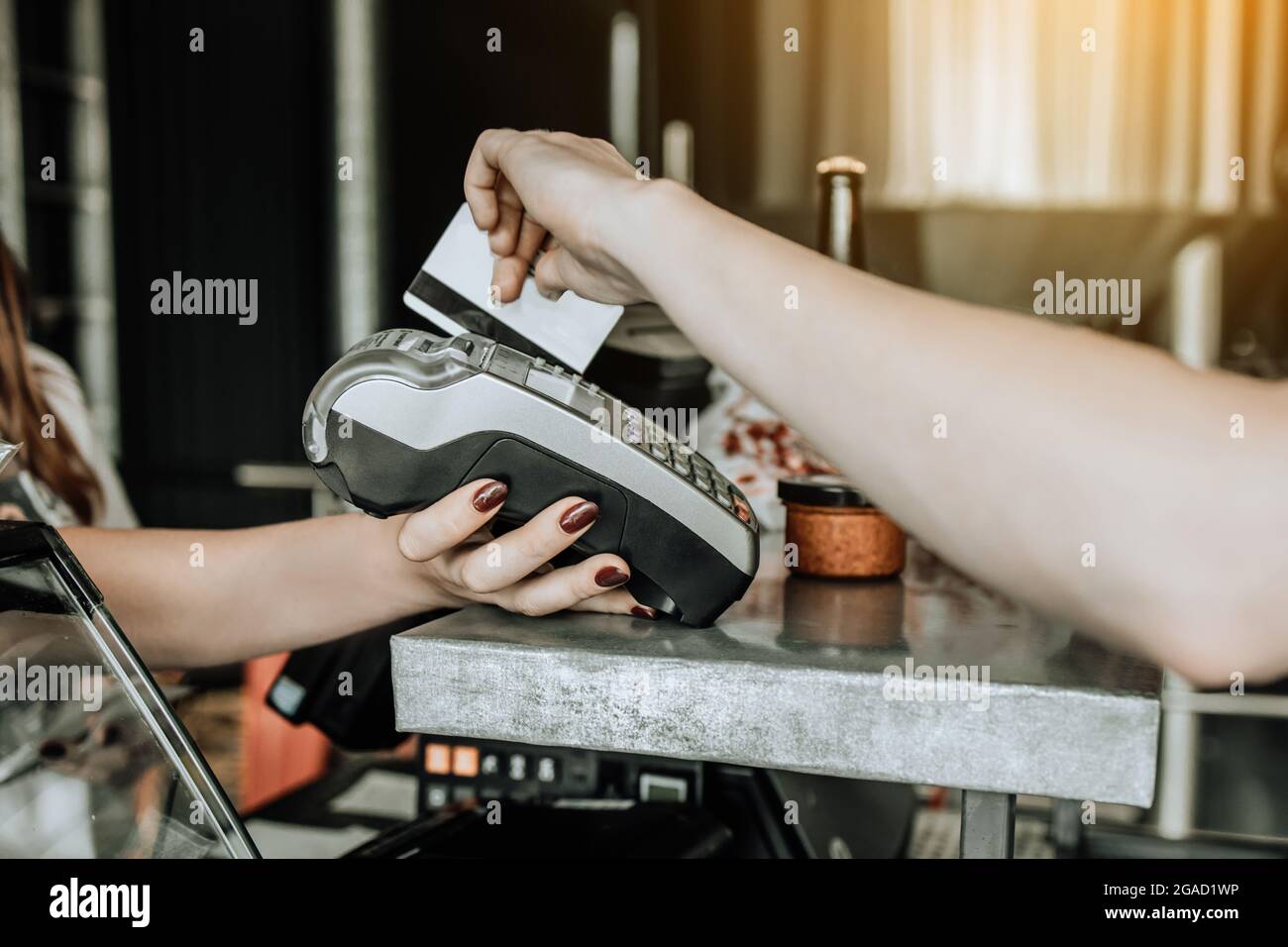 Customer doing payment credit card in cafe or shop Stock Photo - Alamy