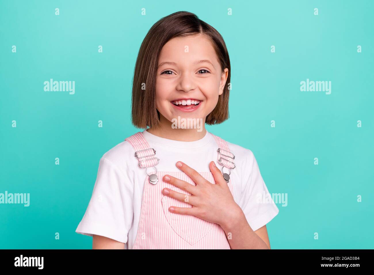 Photo of shiny impressed schoolgirl dressed pink overall arm chest ...