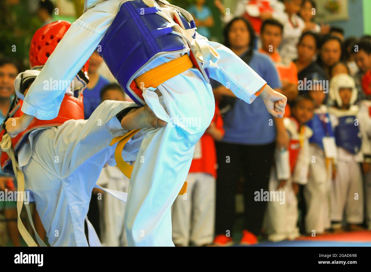 Kids fighting on stage during Taekwondo tournament Stock Photo - Alamy