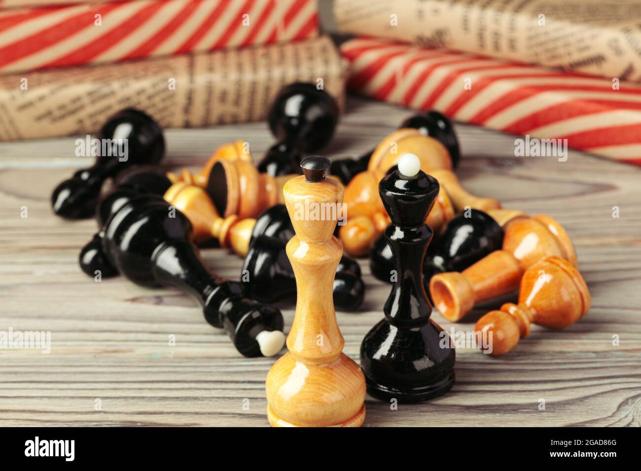 chess figures on brown woden table background Stock Photo - Alamy