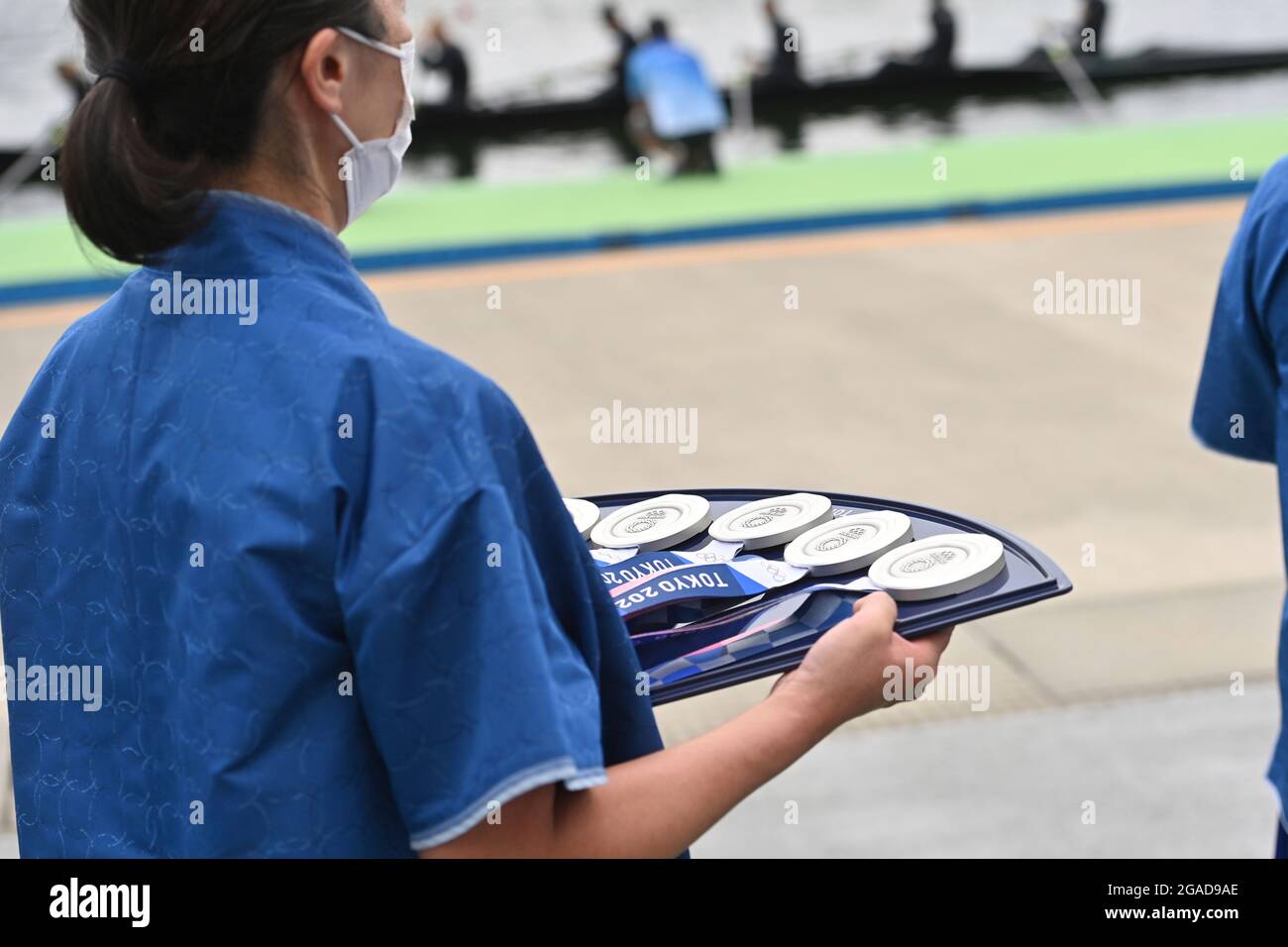 Tokyo, Japan. 30th July, 2021. Award ceremony: a hostess brings the ...