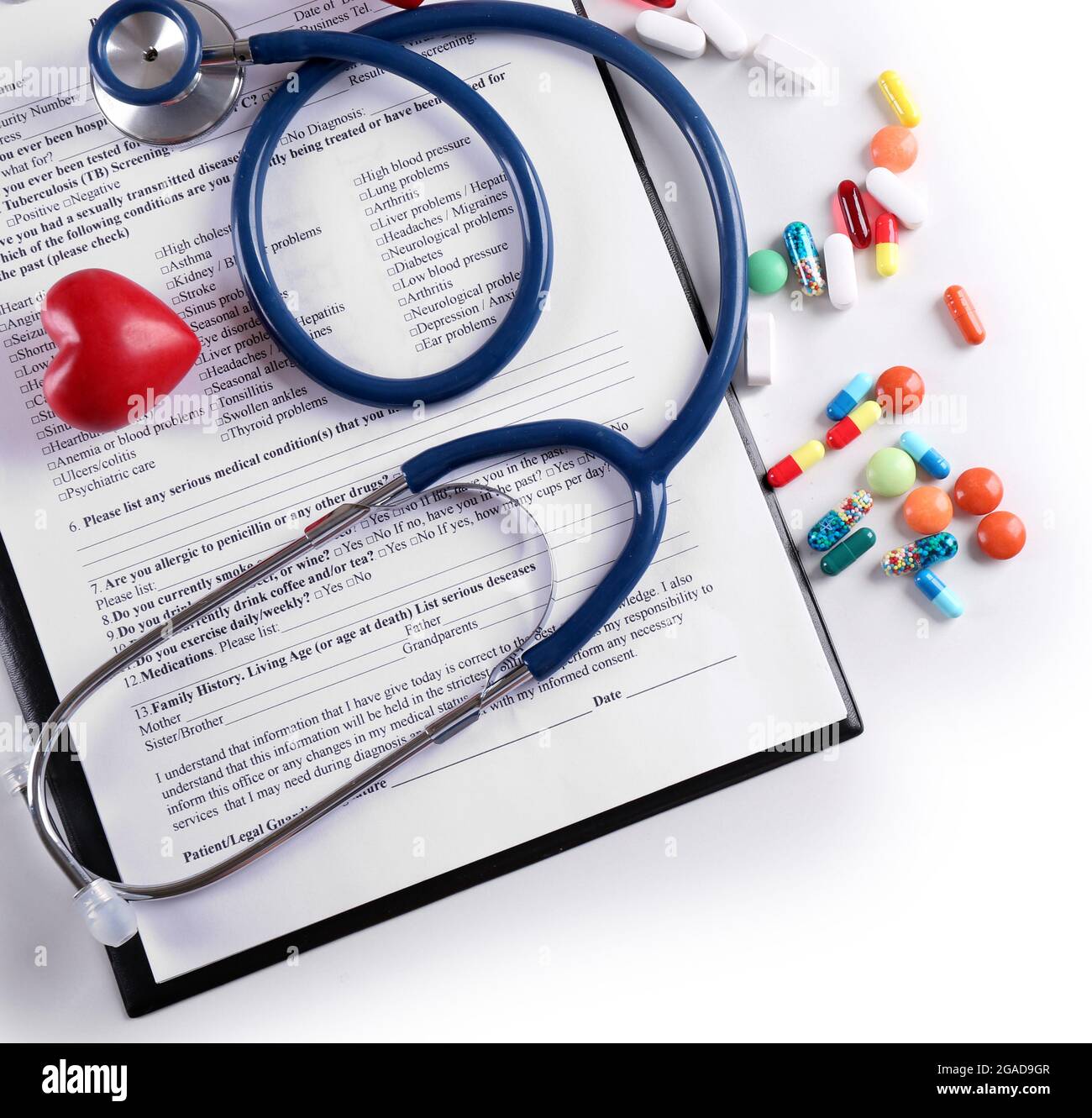 Stethoscope with medical history and pills isolated on white Stock ...