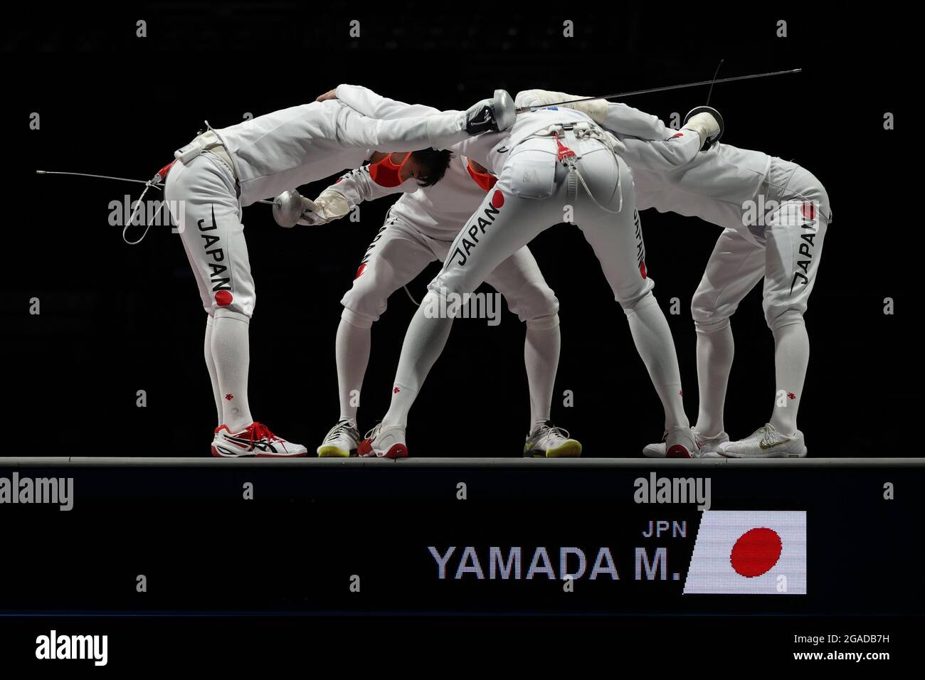 Chiba, Japan. 30th July, 2021. Fencers of Japan cheer up before the ...