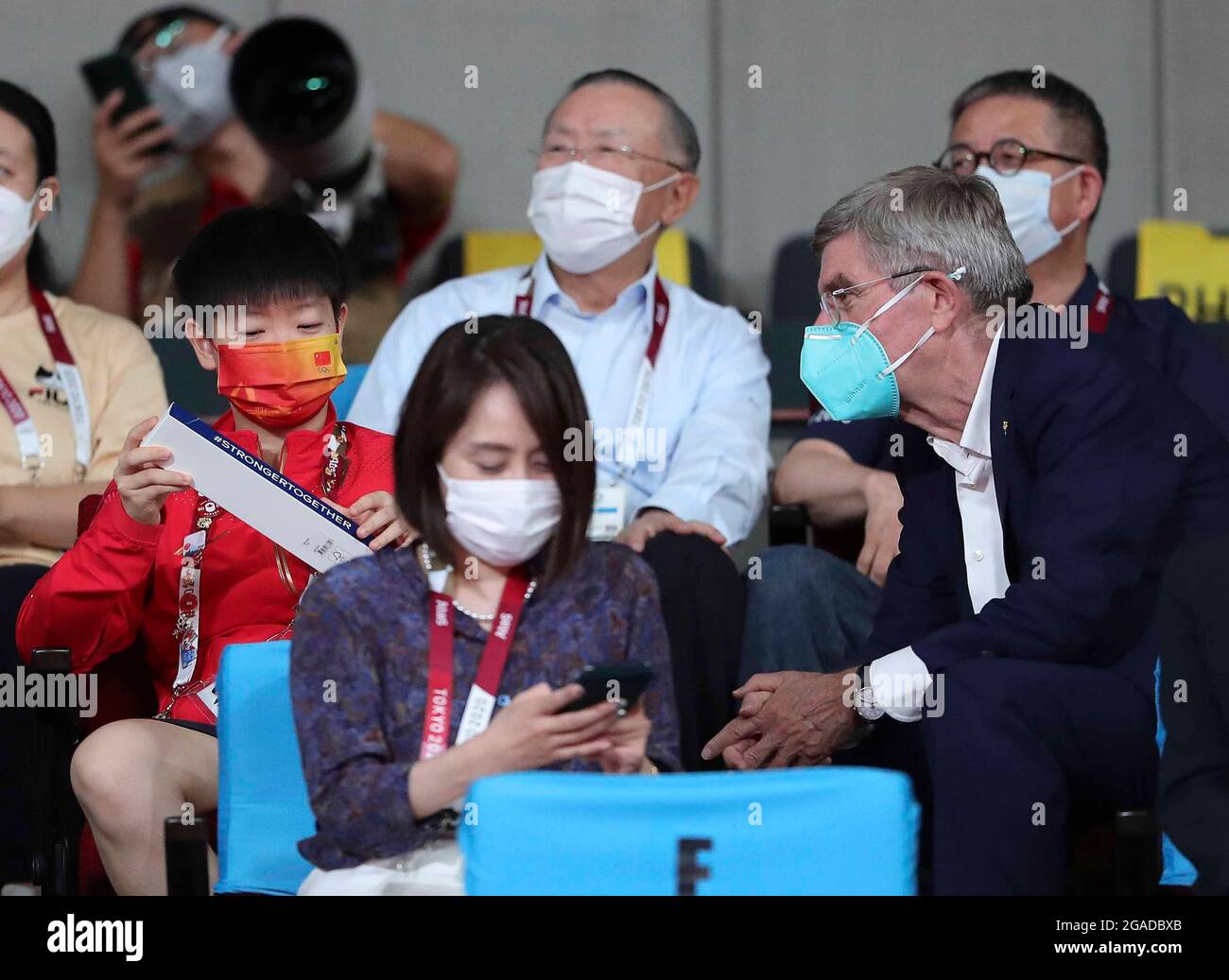 Tokyo, Japan. 30th July, 2021. International Olympic Committee President Thomas Bach (1st, R ...