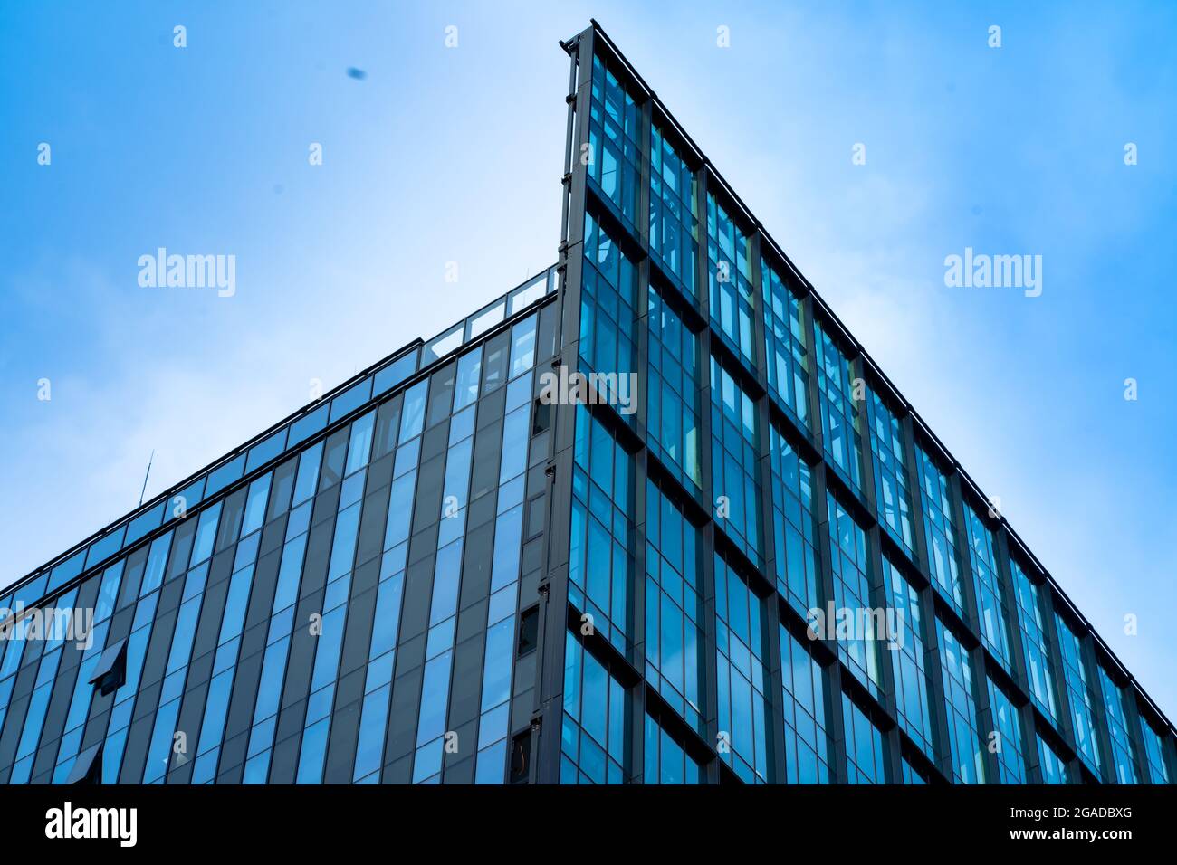 Bright blue glass building exterior design Stock Photo - Alamy