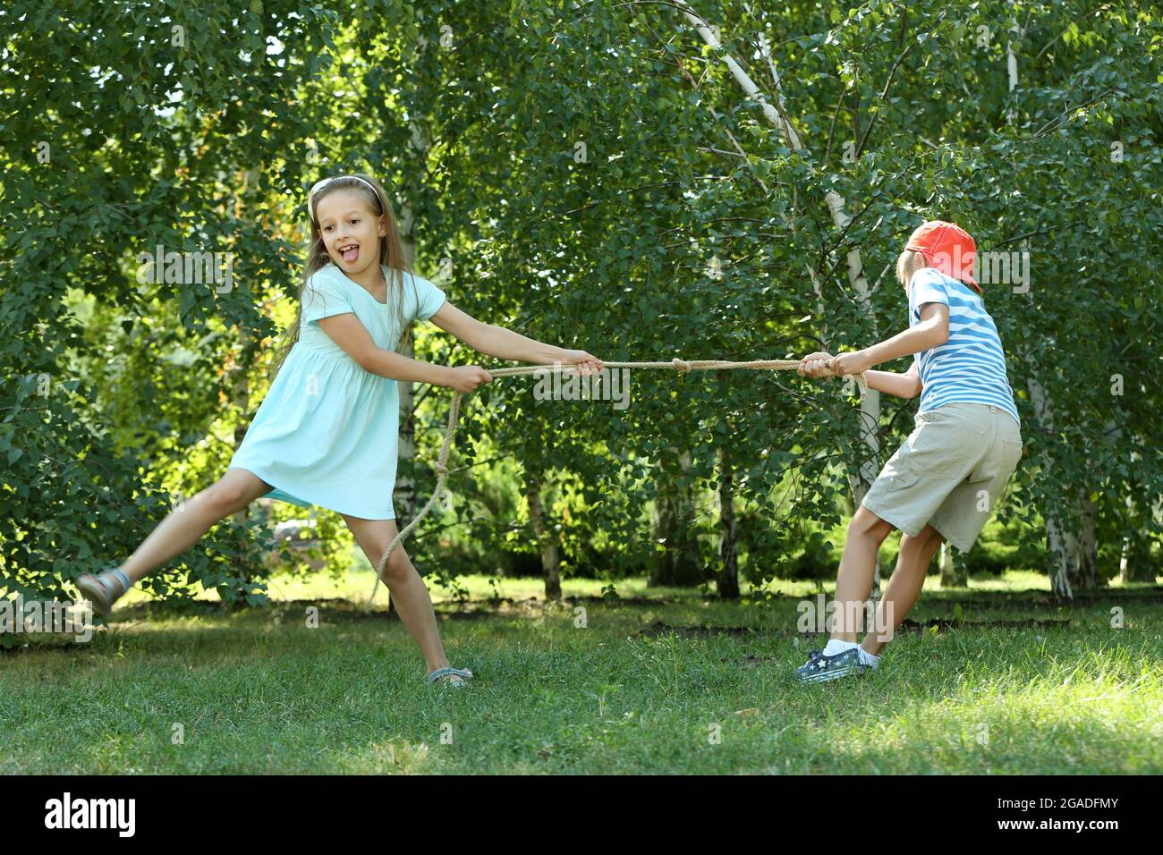 Happy active children playing in park Stock Photo - Alamy