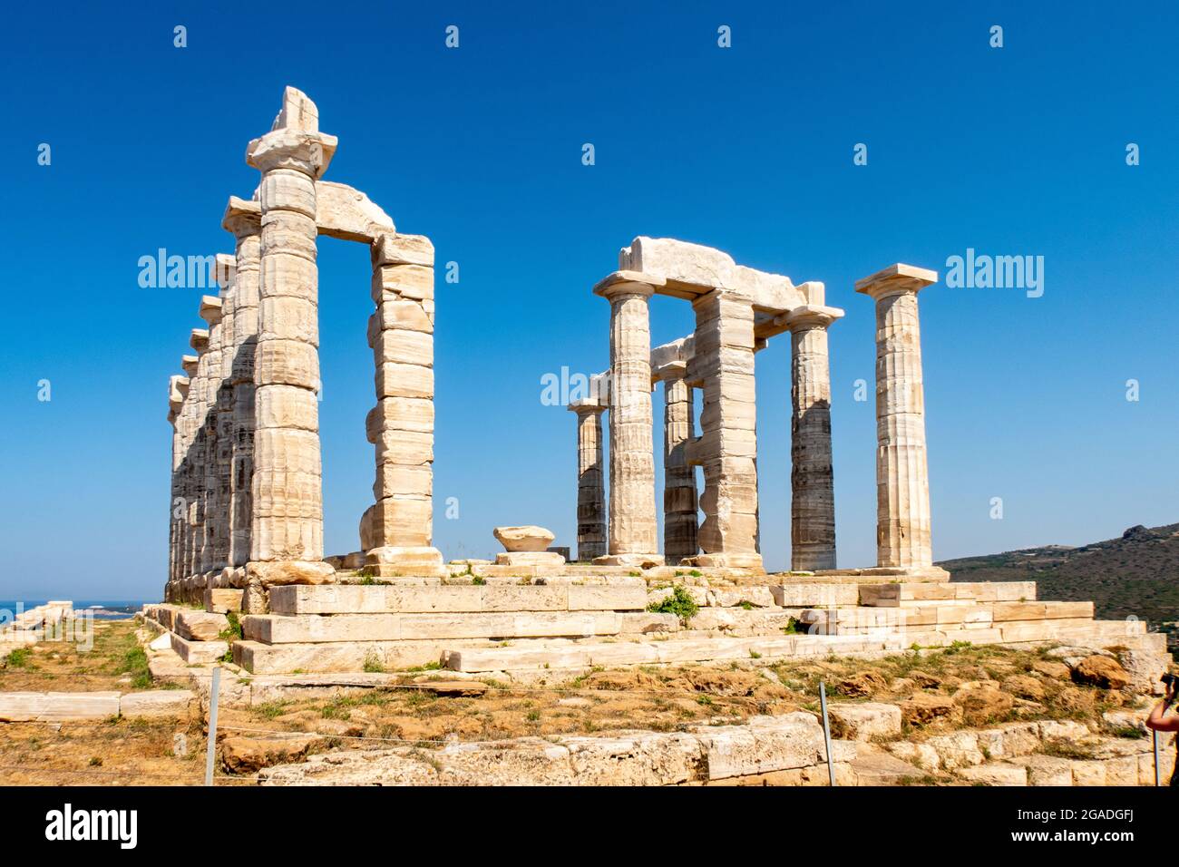 The ancient Greek Temple of Poseidon at Cape Sounion, doric columns and ...