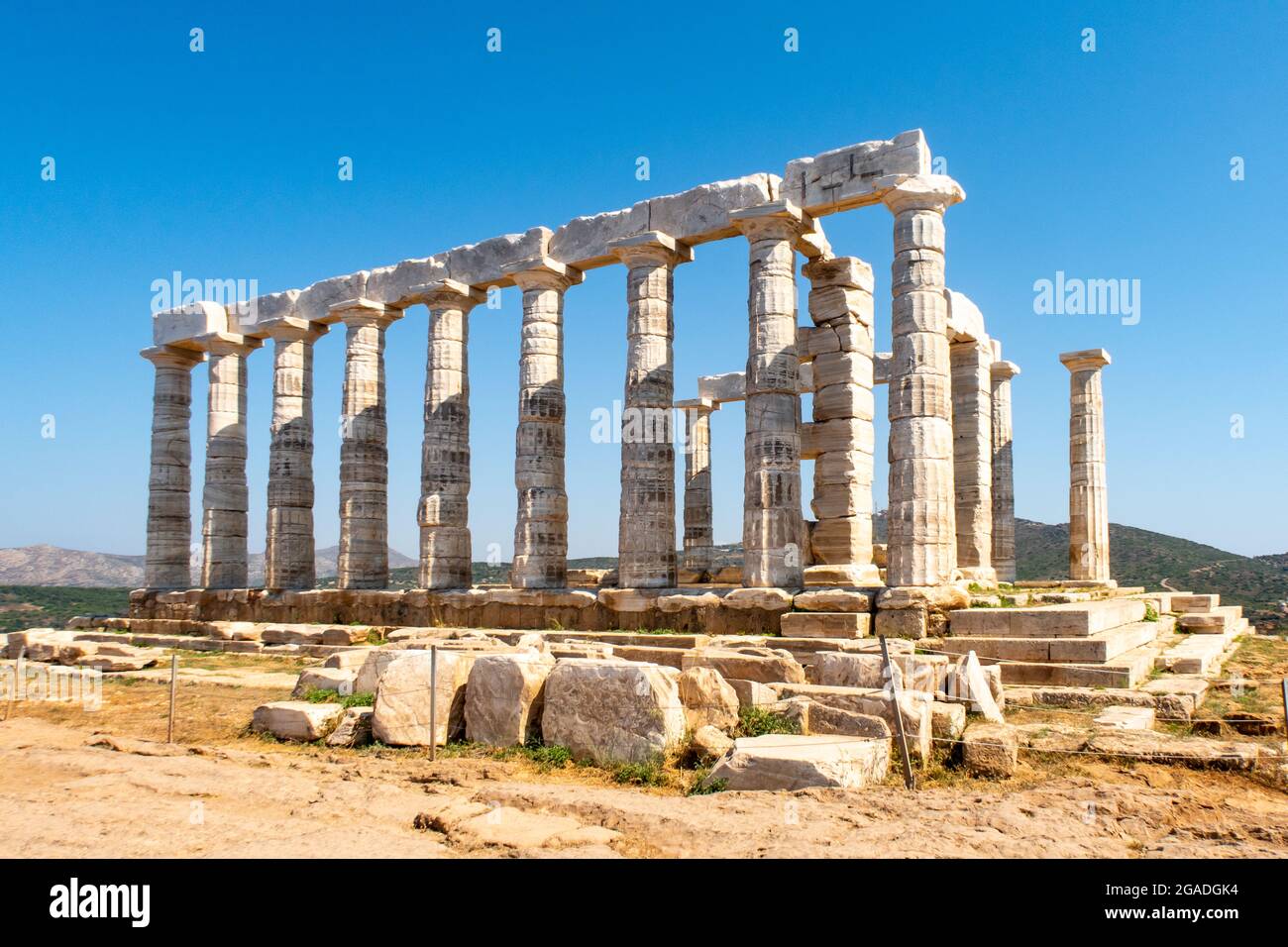 The ancient Greek Temple of Poseidon at Cape Sounion, doric columns and ...